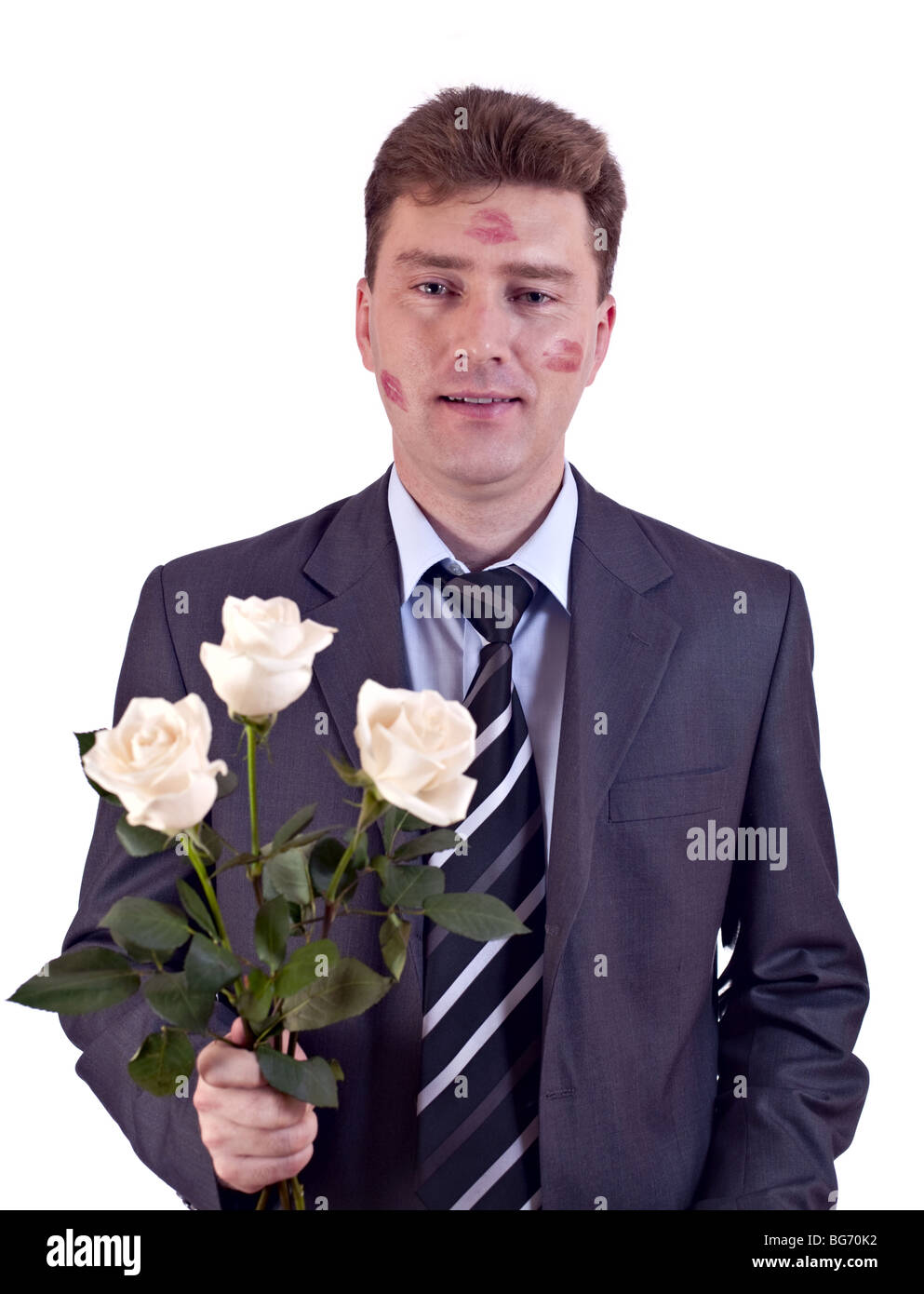 Kissed man with white roses isolated over white Stock Photo - Alamy