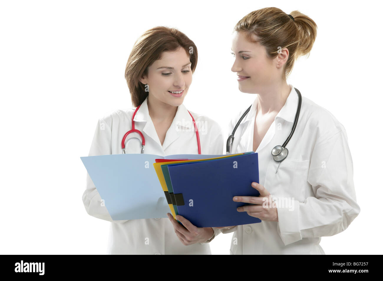 Two doctor women isolated on white studio background Stock Photo - Alamy
