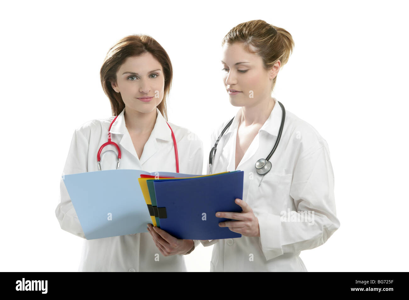 Two doctor women isolated on white studio background Stock Photo - Alamy