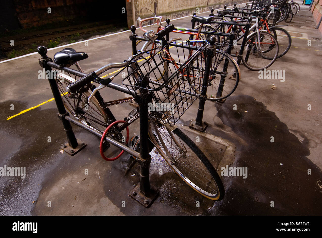 Commuters bikes in a train station Stock Photo - Alamy