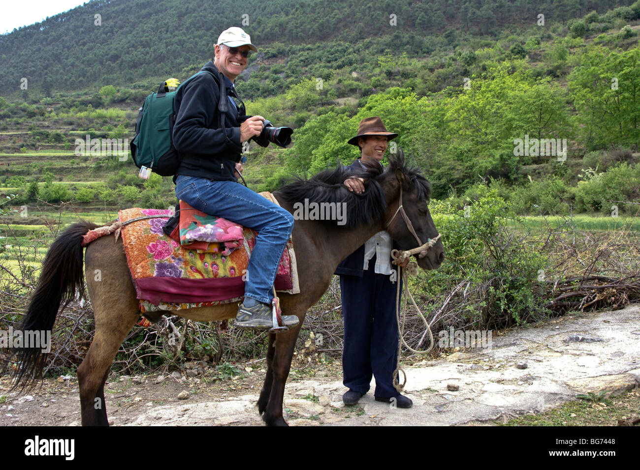 Tourist riding horse, Shangri-la, Yunnan, China Stock Photo - Alamy