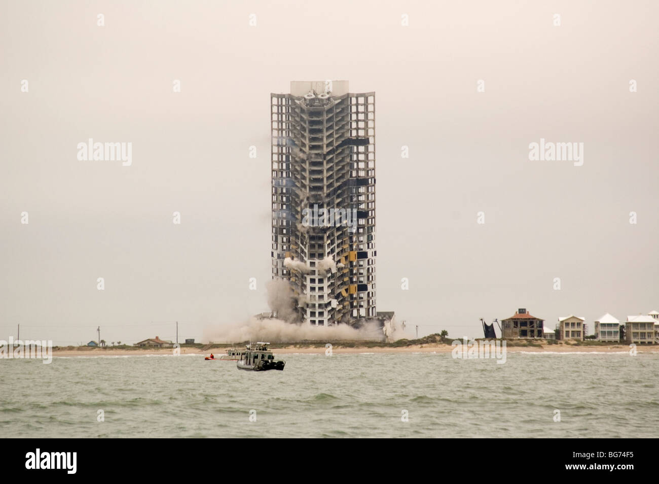 Ocean Tower seconds after implosion charges detonated. Center of the ...