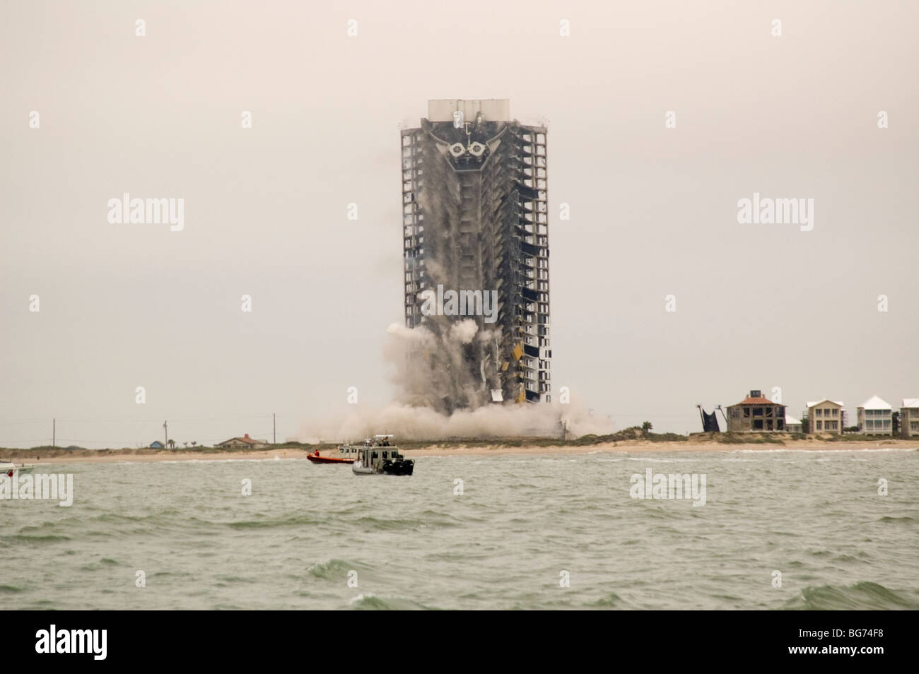 Ocean Tower in middle stage of collapse after detonation of charges to ...