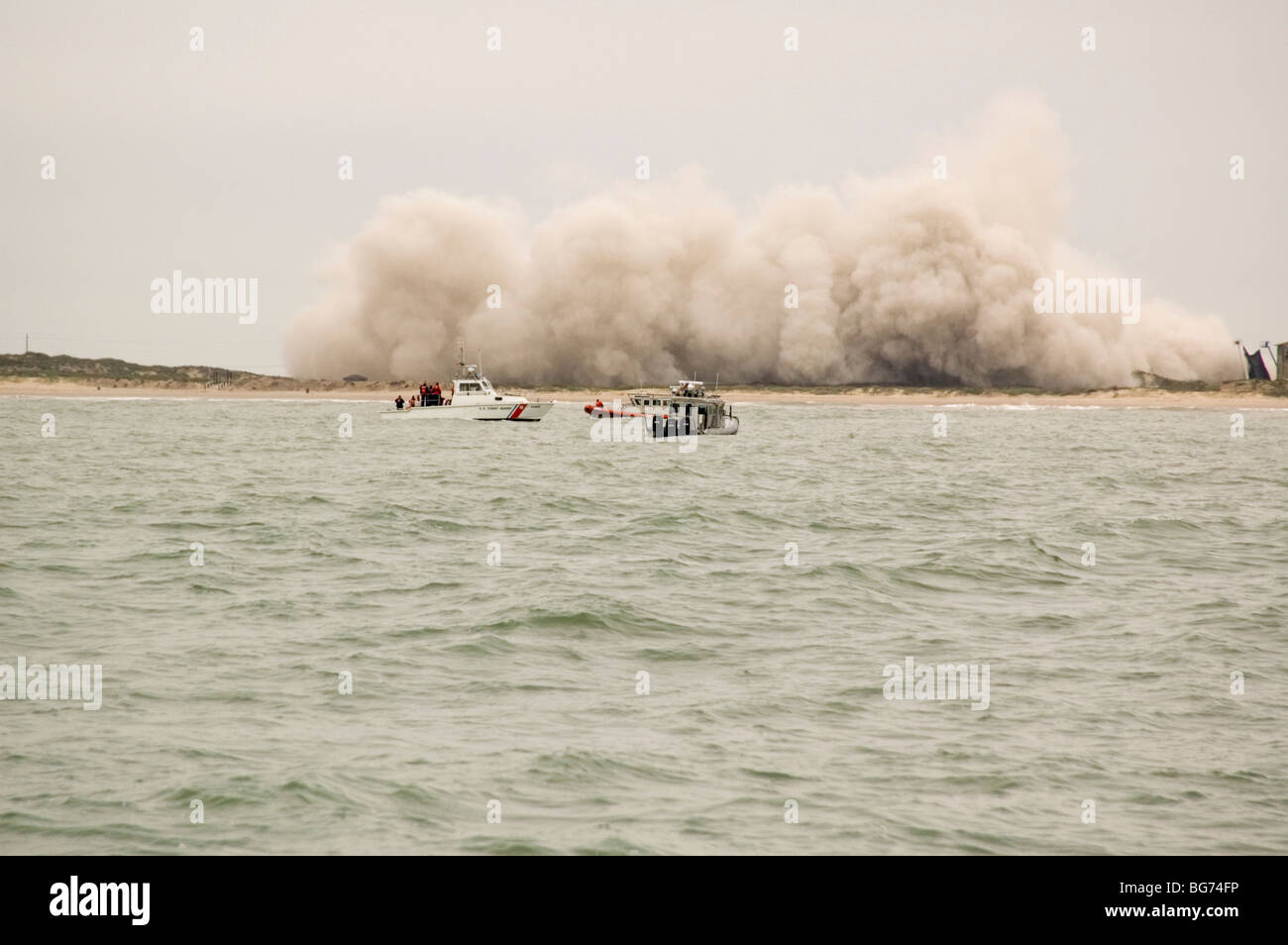 Massive dust cloud drifts on the beach after implosion of Ocean Tower ...