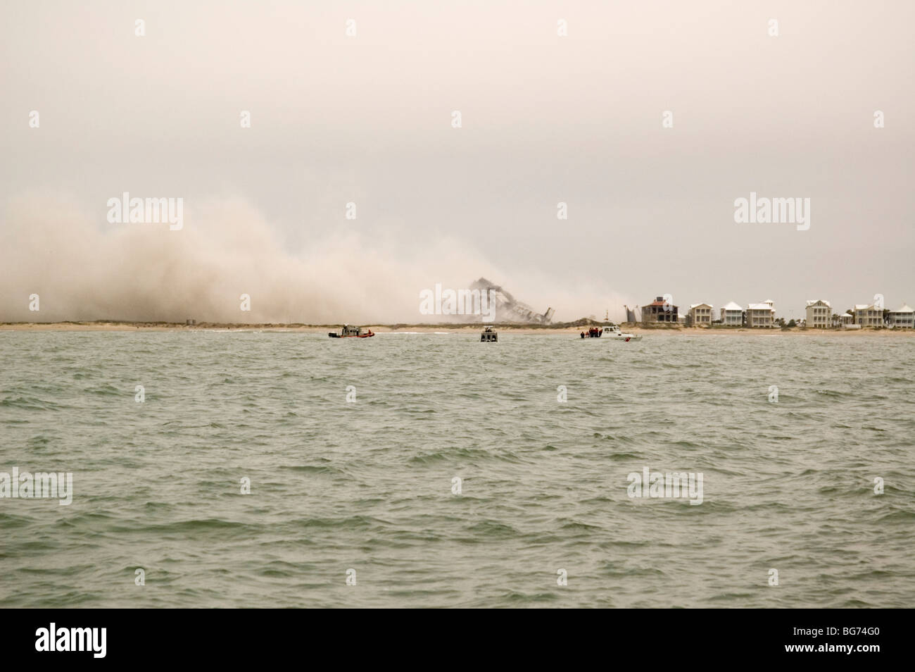Rubble pile emerges from dust cloud after implosion of Ocean Tower ...