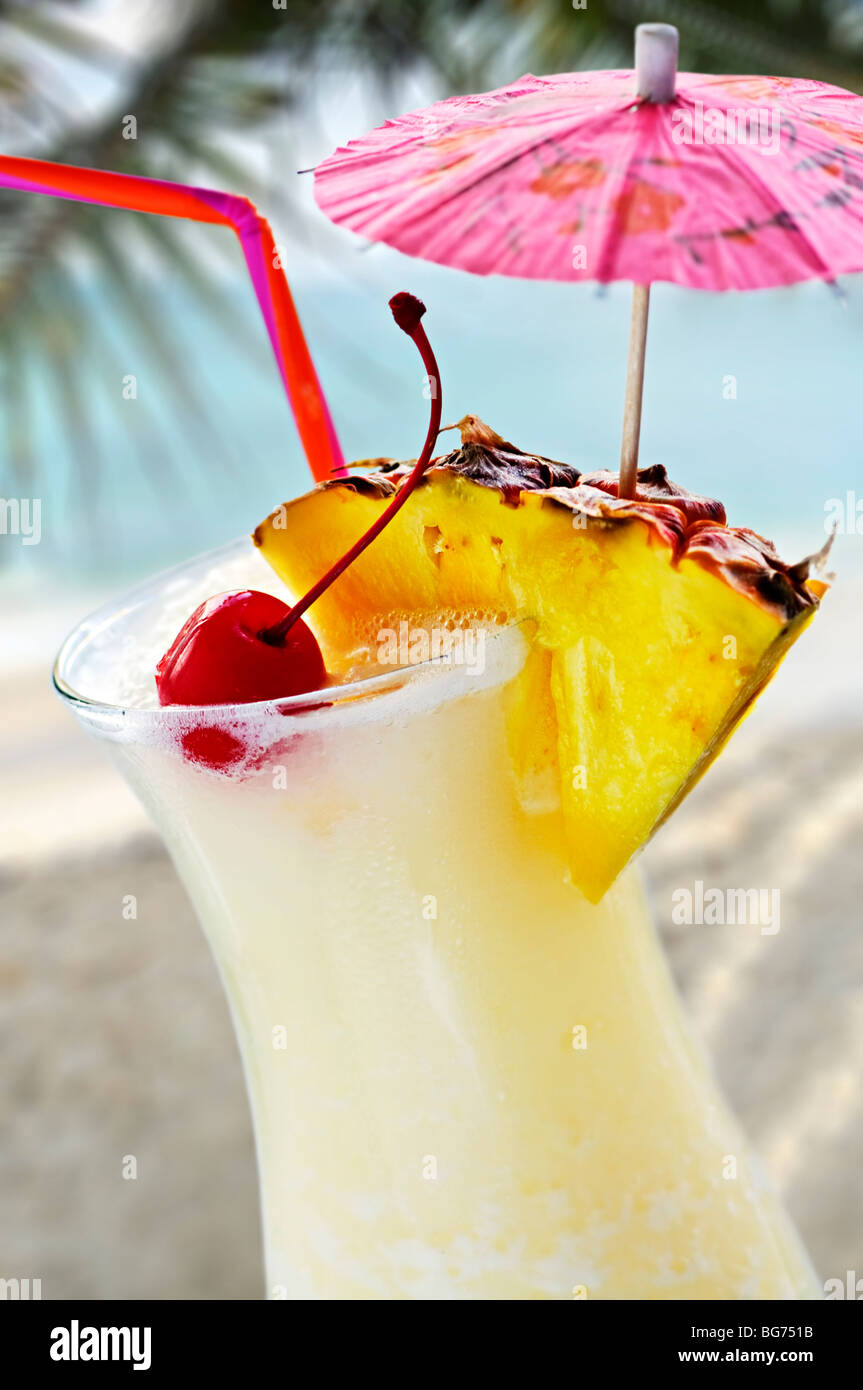 Pina colada tropical drink at sandy beach on the ocean Stock Photo - Alamy
