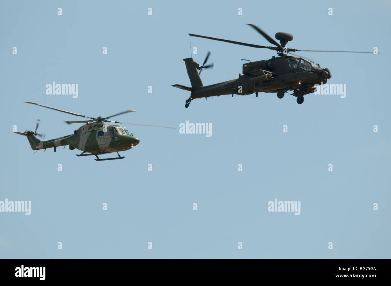 Formation flypast of an Apache and Lynx helicopter at the RAF ...