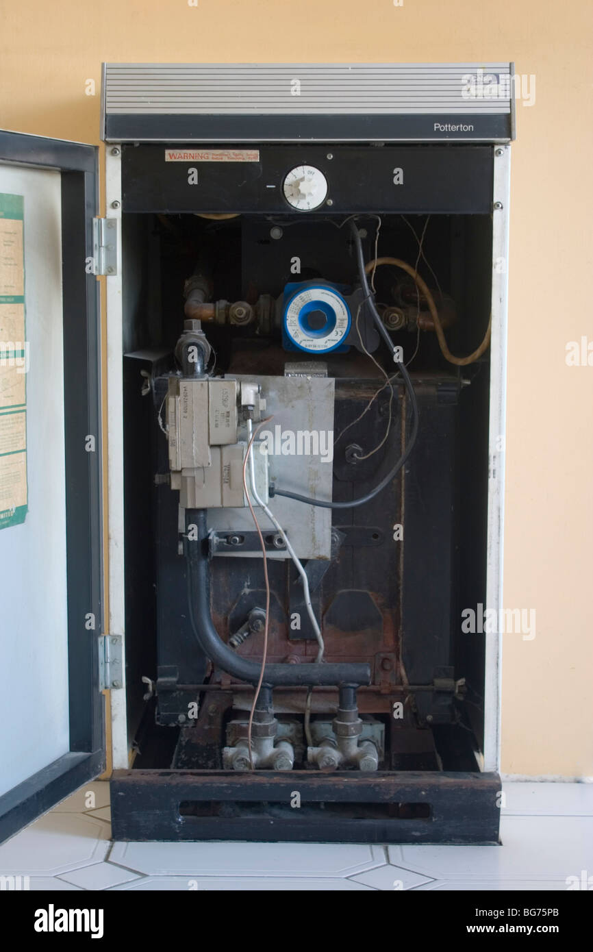 Old, inefficient, domestic gas central heating boiler, London UK Stock ...