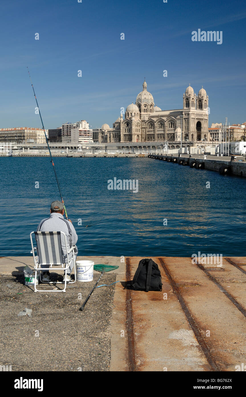 Fisherman Sitting or Fishing in Front of Cathedral or Cathédrale de la ...