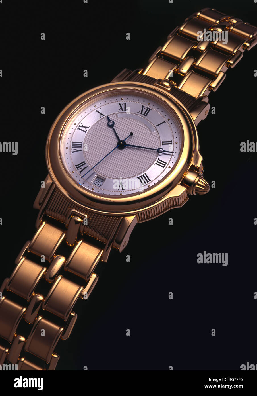 Rich wristwatch in a gold frame with a bangle on black background ...