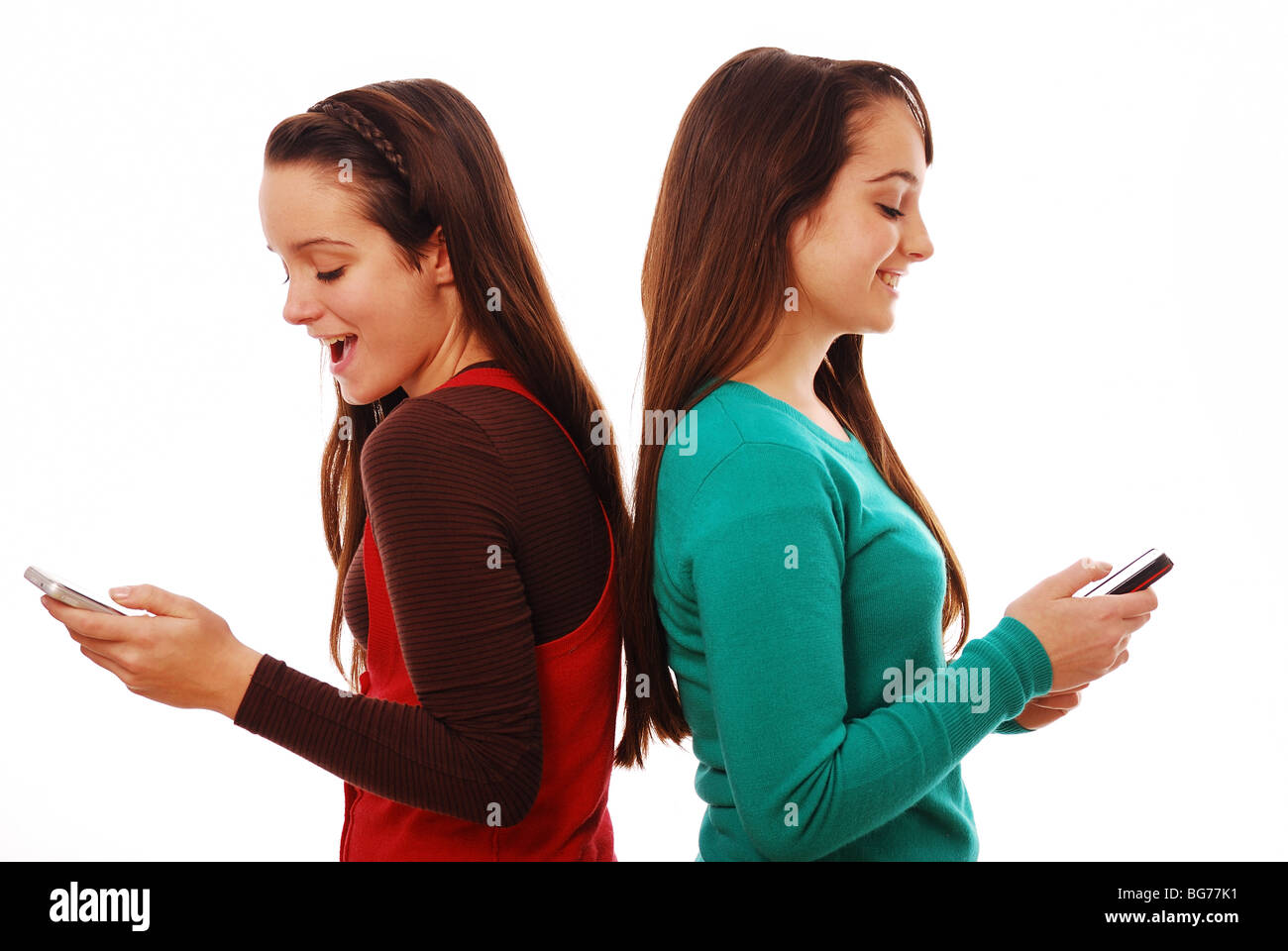 Teenagers texting on mobile phones Stock Photo - Alamy