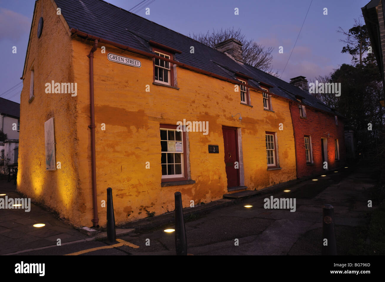 Traditional welsh cottages in lime wash yellow and red, Cardigan Castle ...
