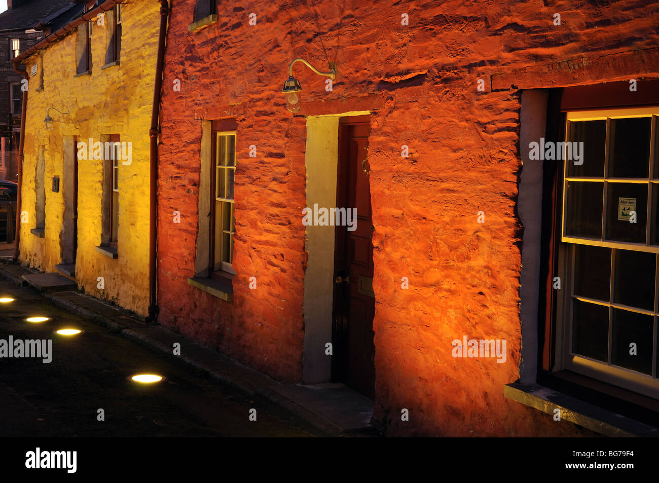 Traditional welsh cottages in lime wash yellow and red, Cardigan Castle ...