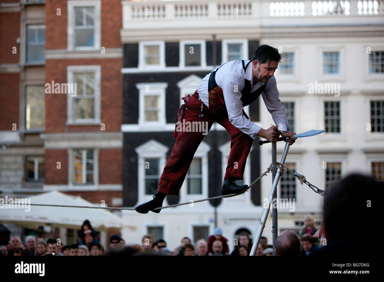 Tightrope walker at Covent Garden Market, London, England, UK Stock ...