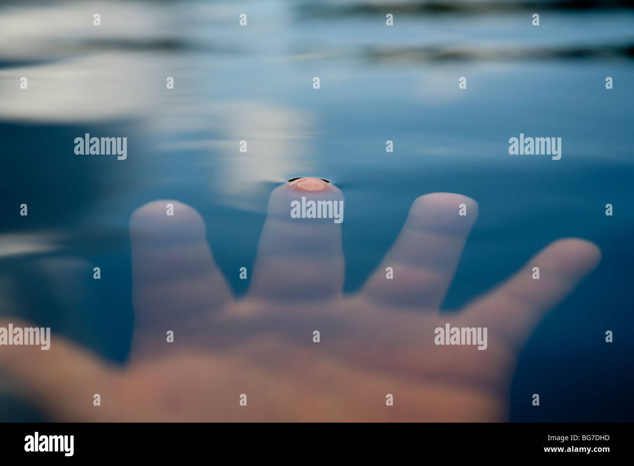 Brown fingers touching surface hi-res stock photography and images - Alamy