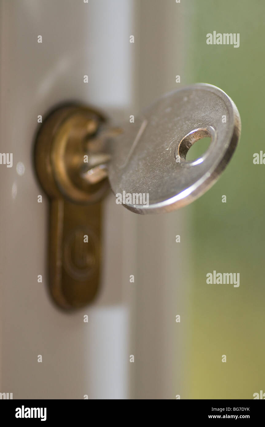Key in lock Stock Photo - Alamy
