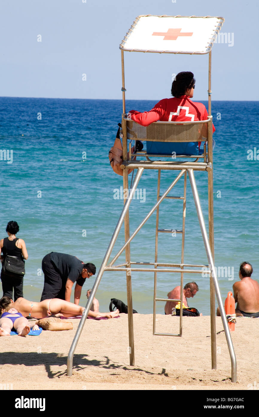 LIFEGUARD, BARCELONA: Beach lifeguard sat watching the beach ...