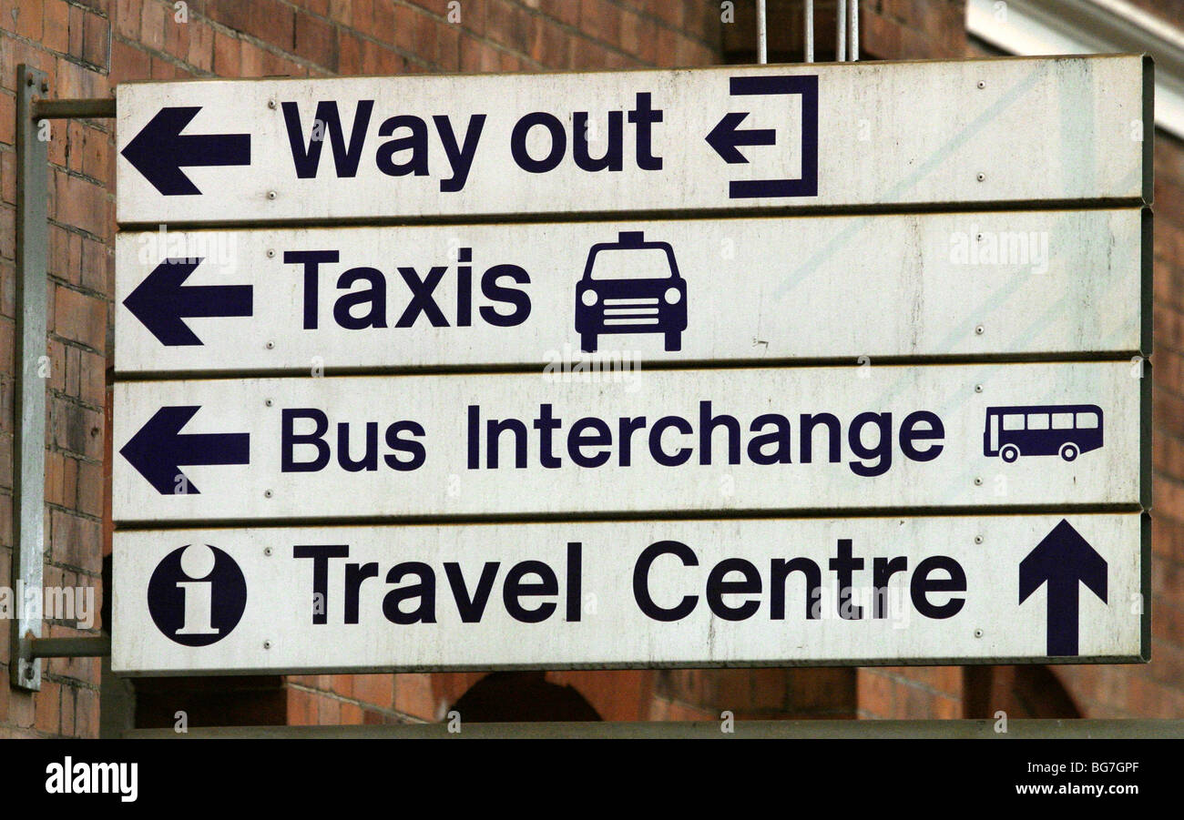 Direction sign at train station Stock Photo - Alamy