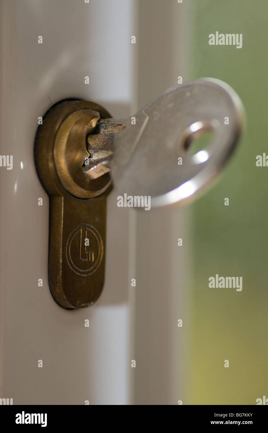 Key in lock Stock Photo - Alamy
