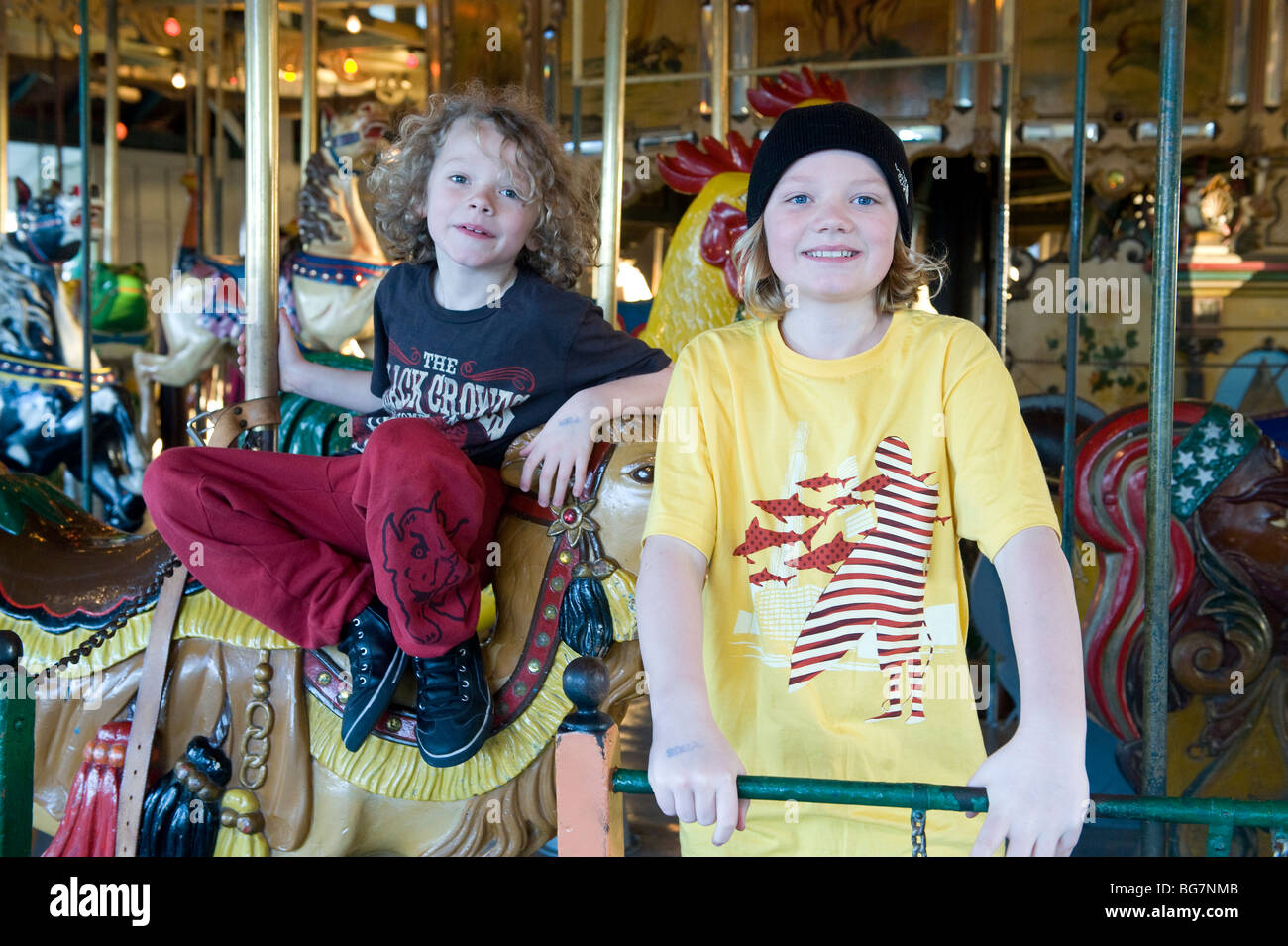 Children riding a beautiful carousel Stock Photo - Alamy