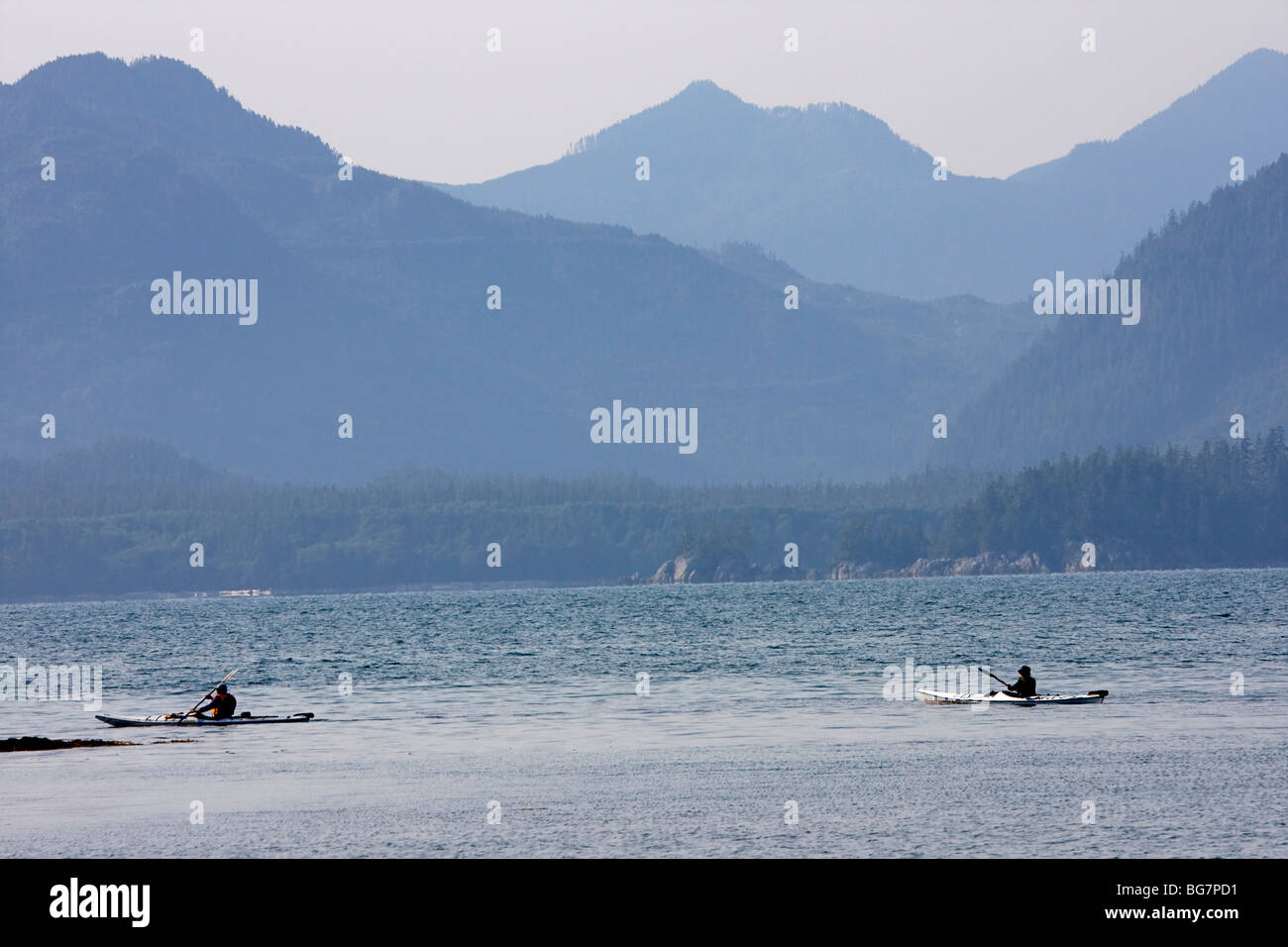 Visitors paddle kayaks in the Broken Group Islands of Pacific Rim ...