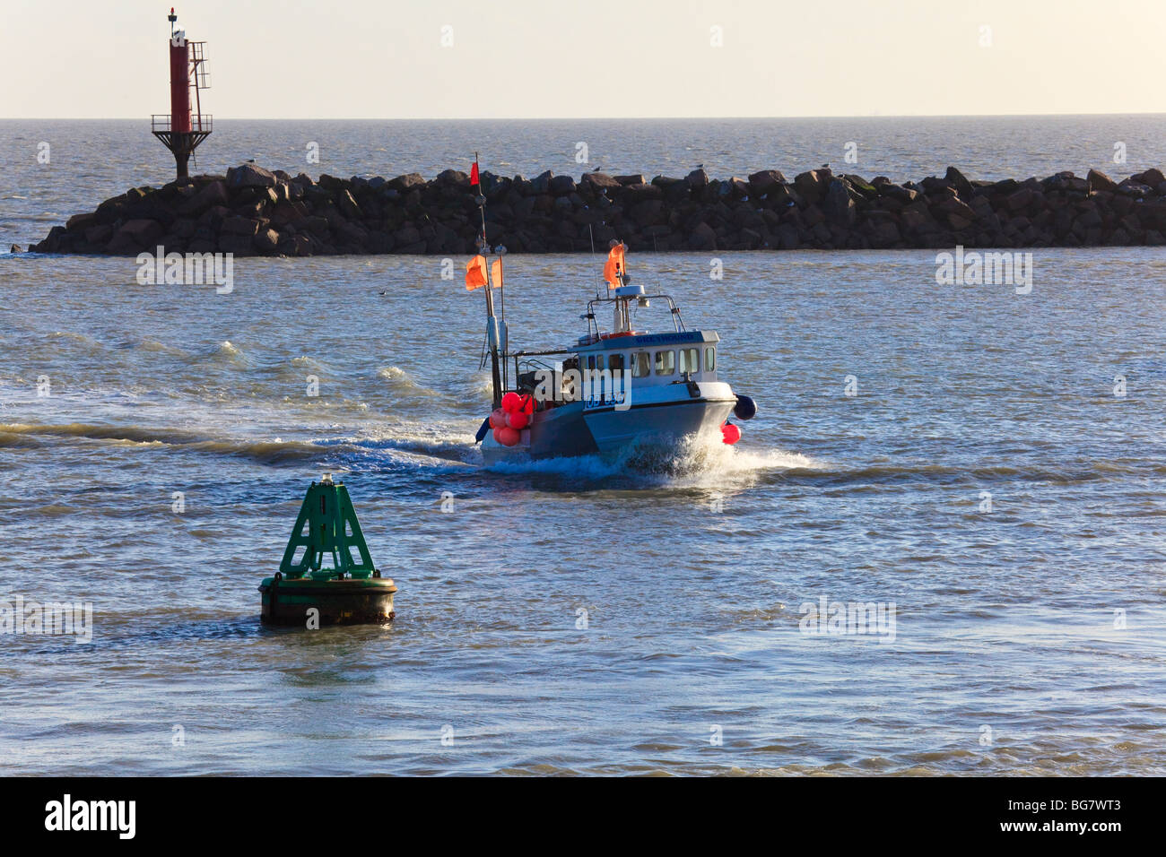 The small fishing boat "Greyhound" rounds a starboard buoy when ...