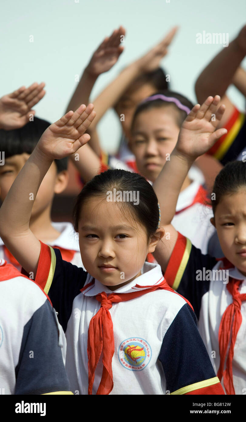 Chinese school girls salute the flag, Beijing, China Stock Photo - Alamy