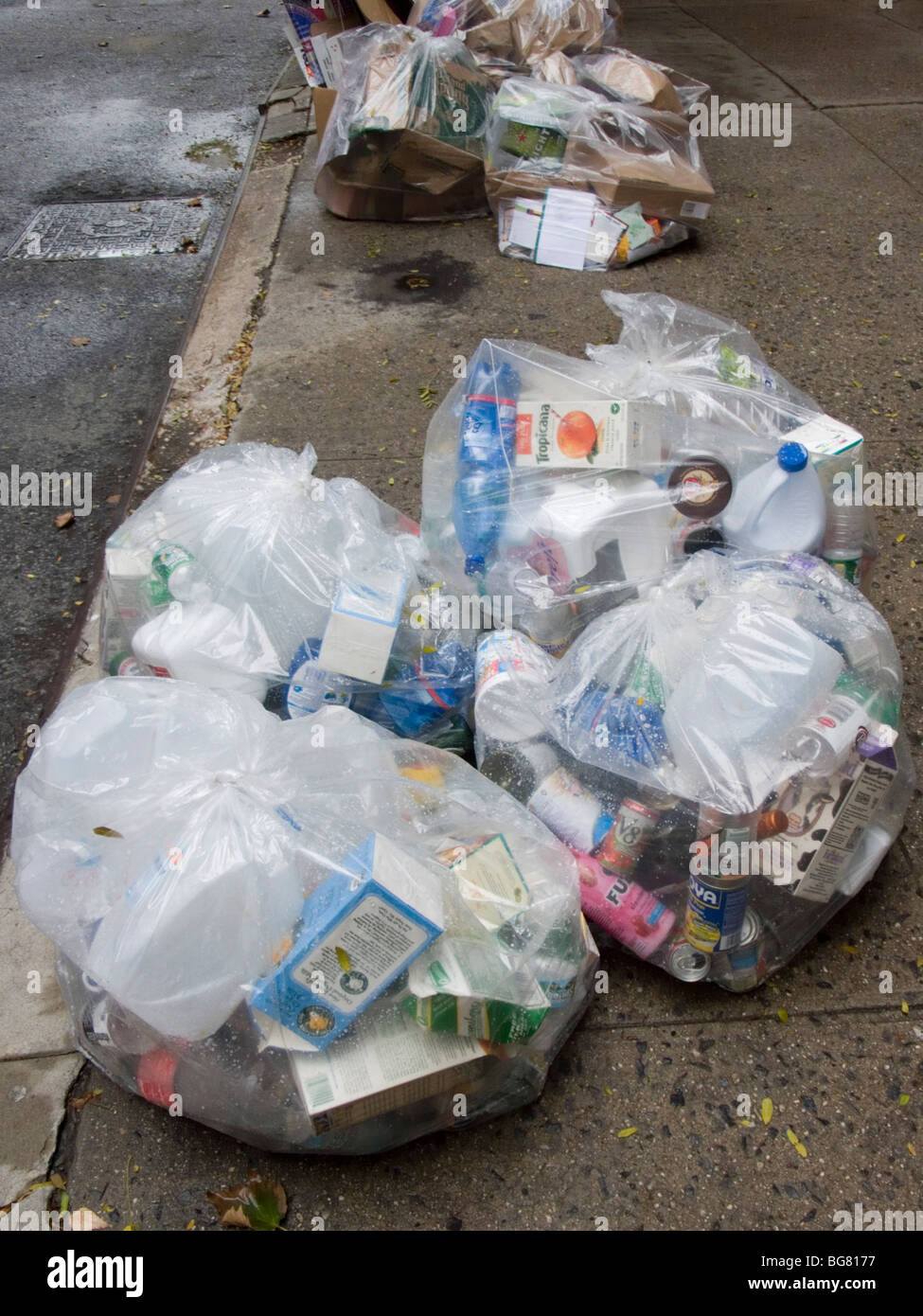Recycling material bagged for collection outside residential building ...