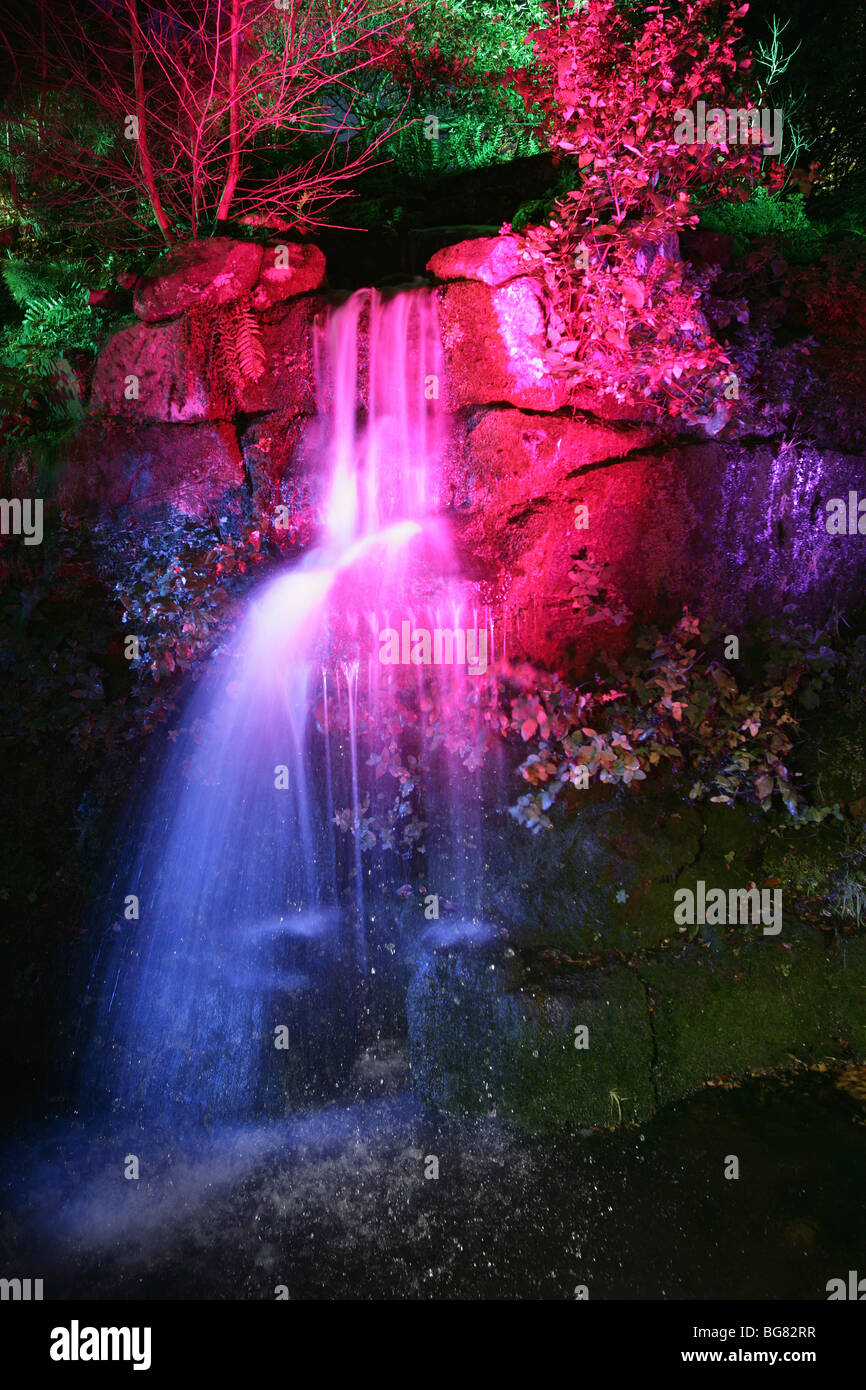 Evening floodlit view of an illuminated water feature waterfall at the ...
