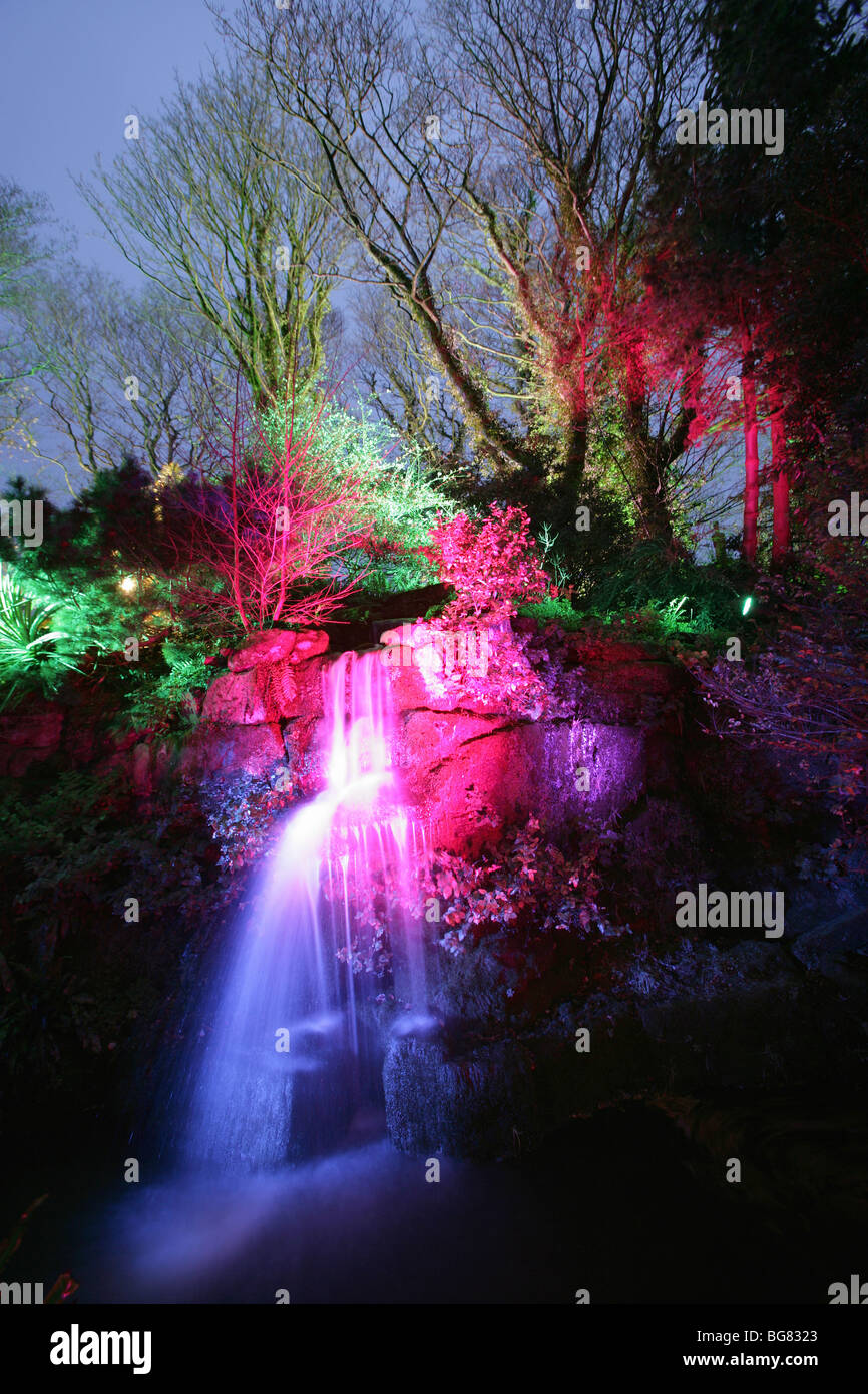 Evening floodlit view of an illuminated water feature waterfall at the ...