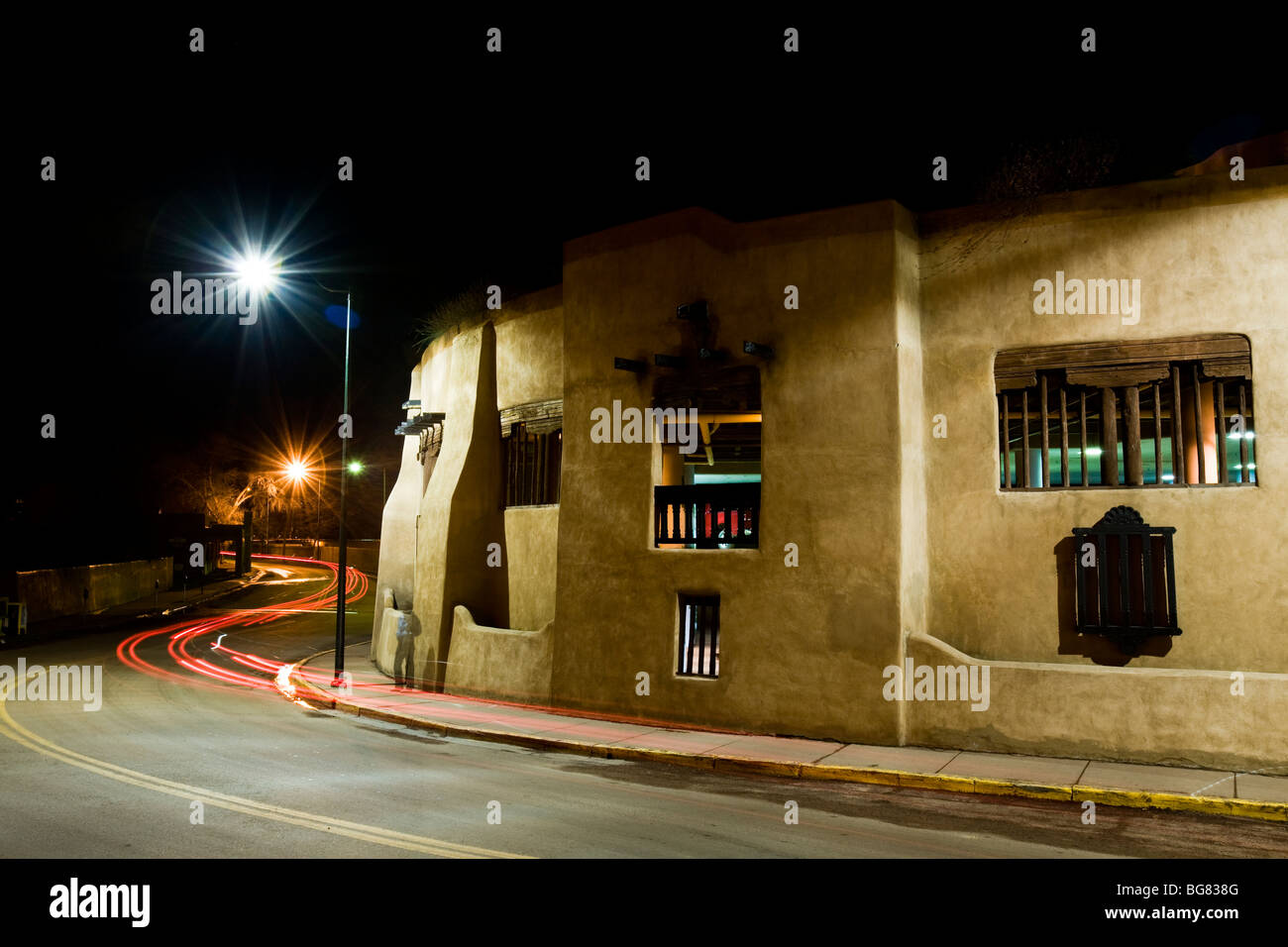 A women standing under a street light in the middle of the night Stock ...