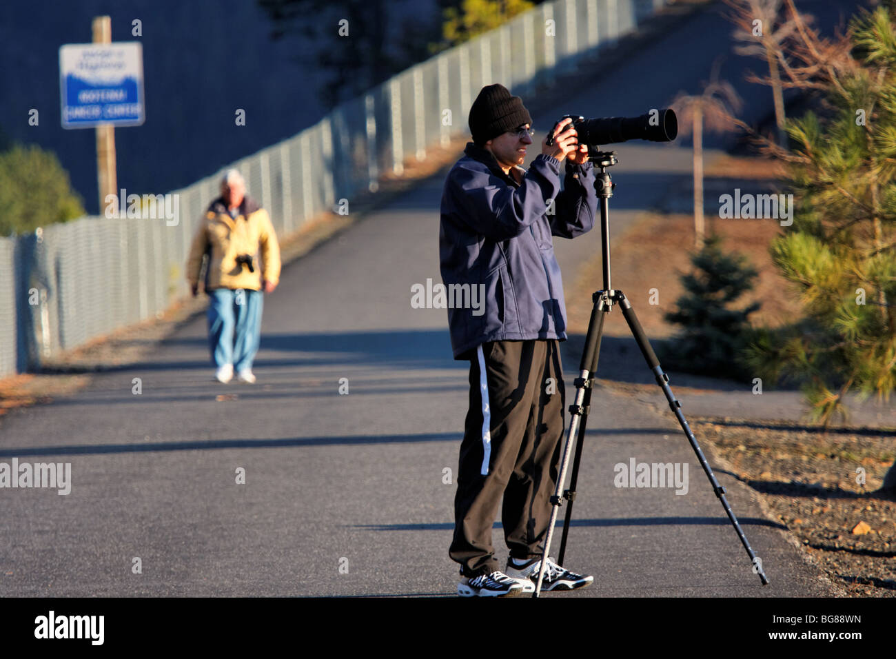 Wildlife photographer, on the Centennial Trail walking path, near Lake ...