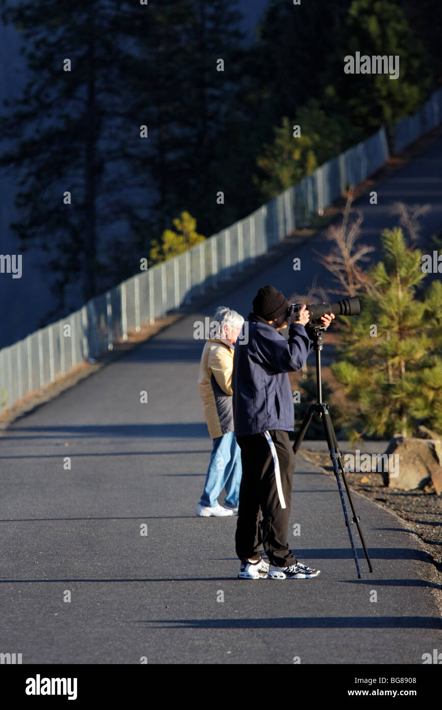 Wildlife photographer, on the Centennial Trail walking path, near Lake ...
