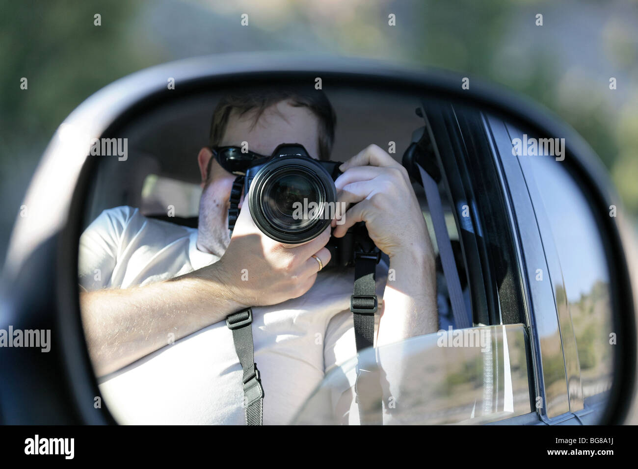 Photographer taking self portrait in car mirror Stock Photo - Alamy