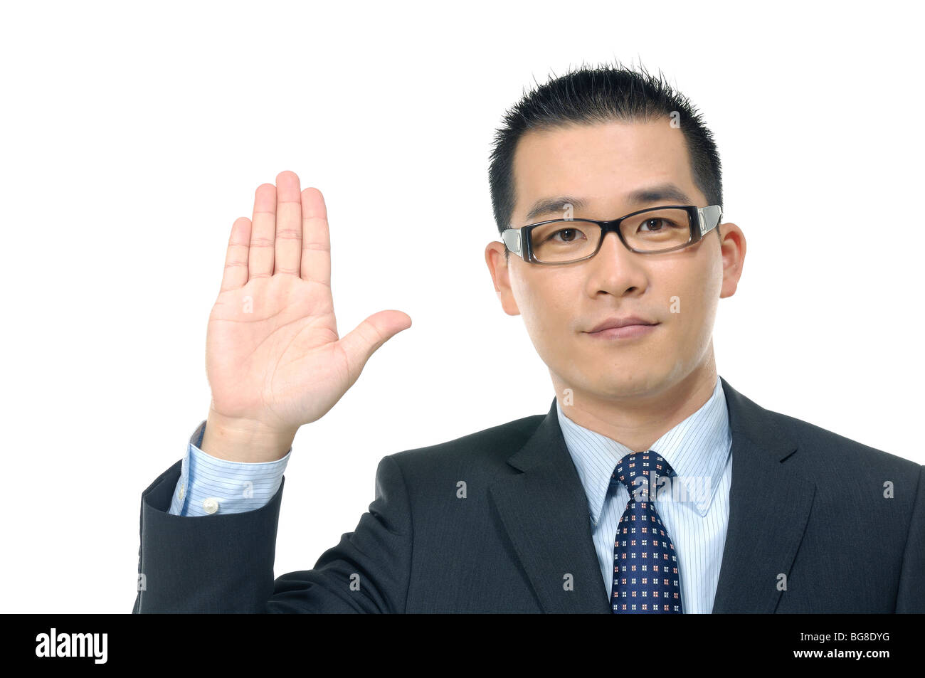 Businessman showing stop sign Stock Photo - Alamy