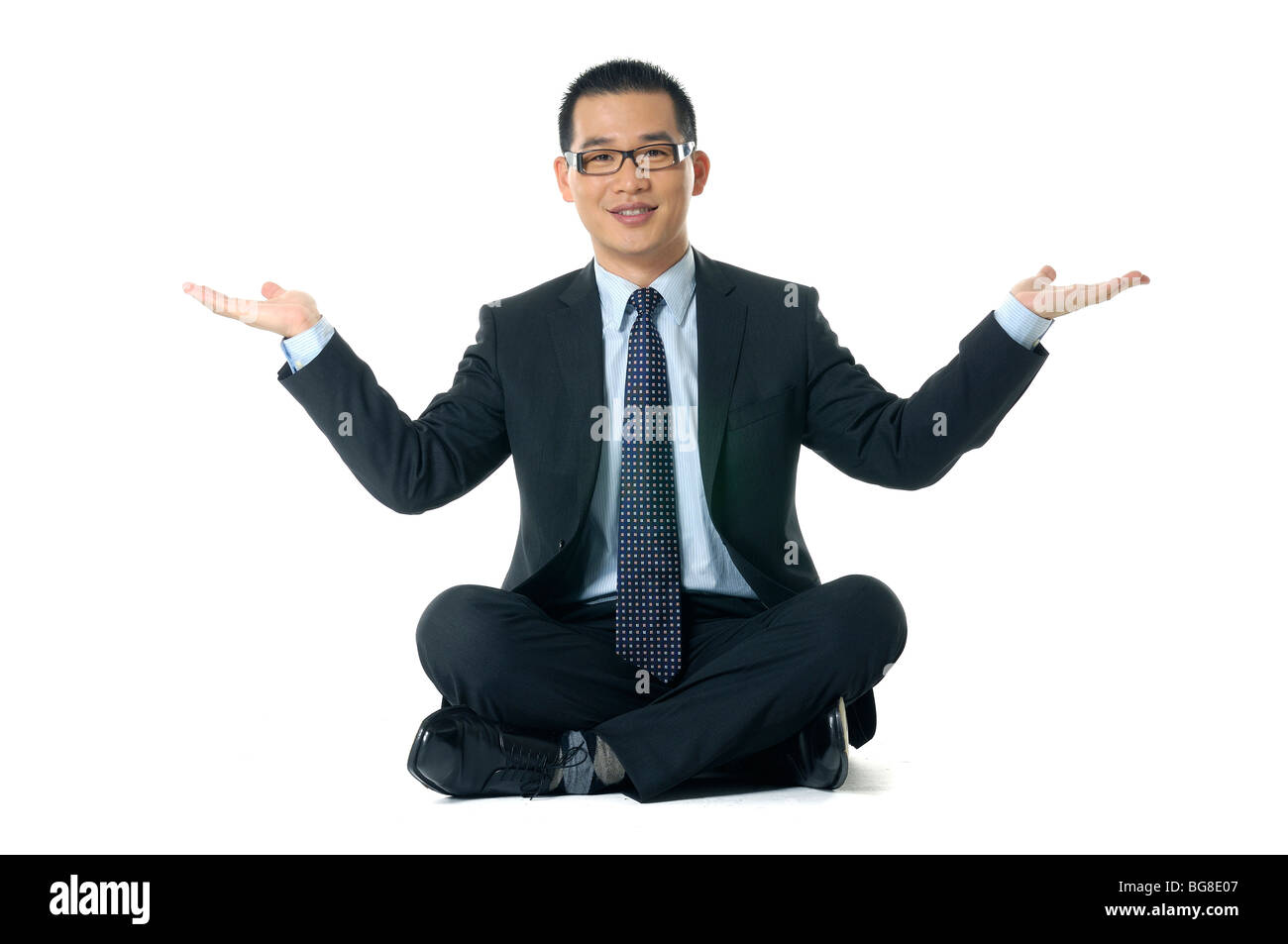 Portrait of a businessman shrugging Stock Photo - Alamy