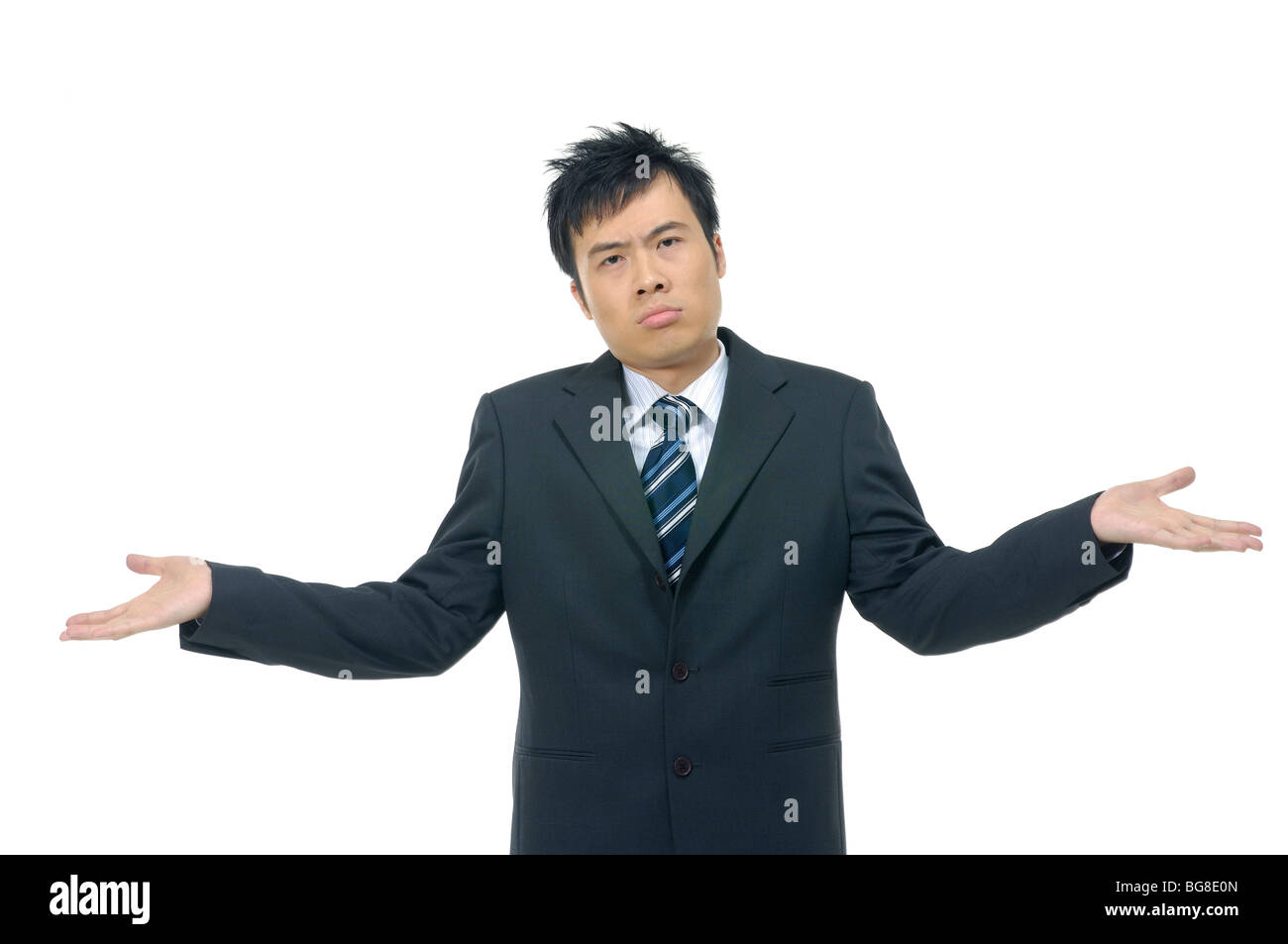 Portrait of a businessman shrugging Stock Photo - Alamy