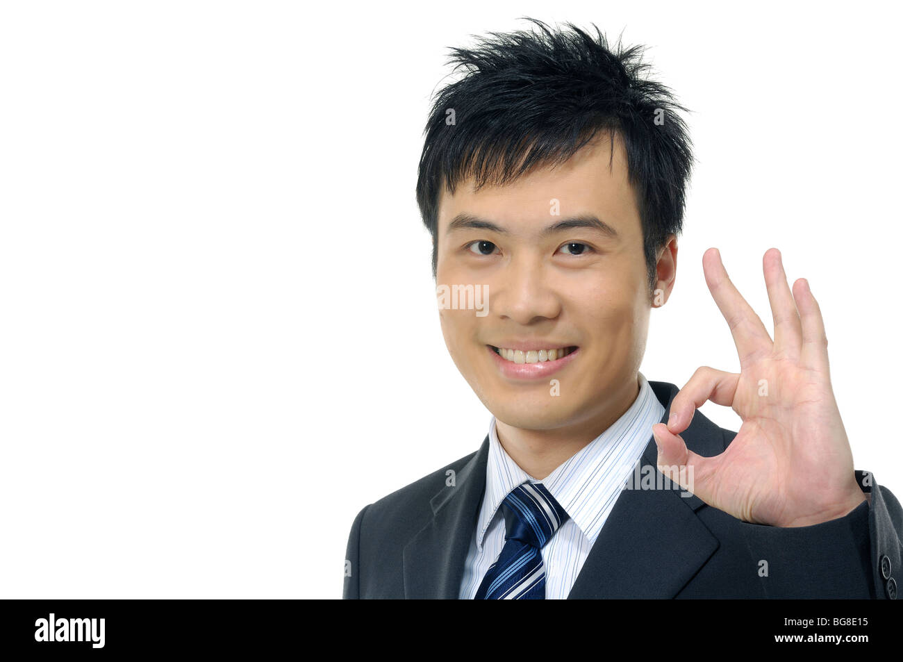 Businessman showing OK sign Stock Photo - Alamy