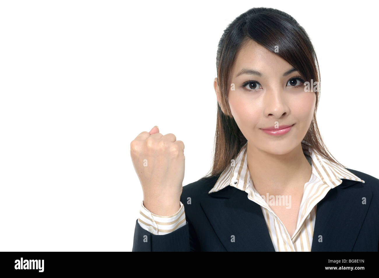 Businesswoman clenching her fist Stock Photo - Alamy