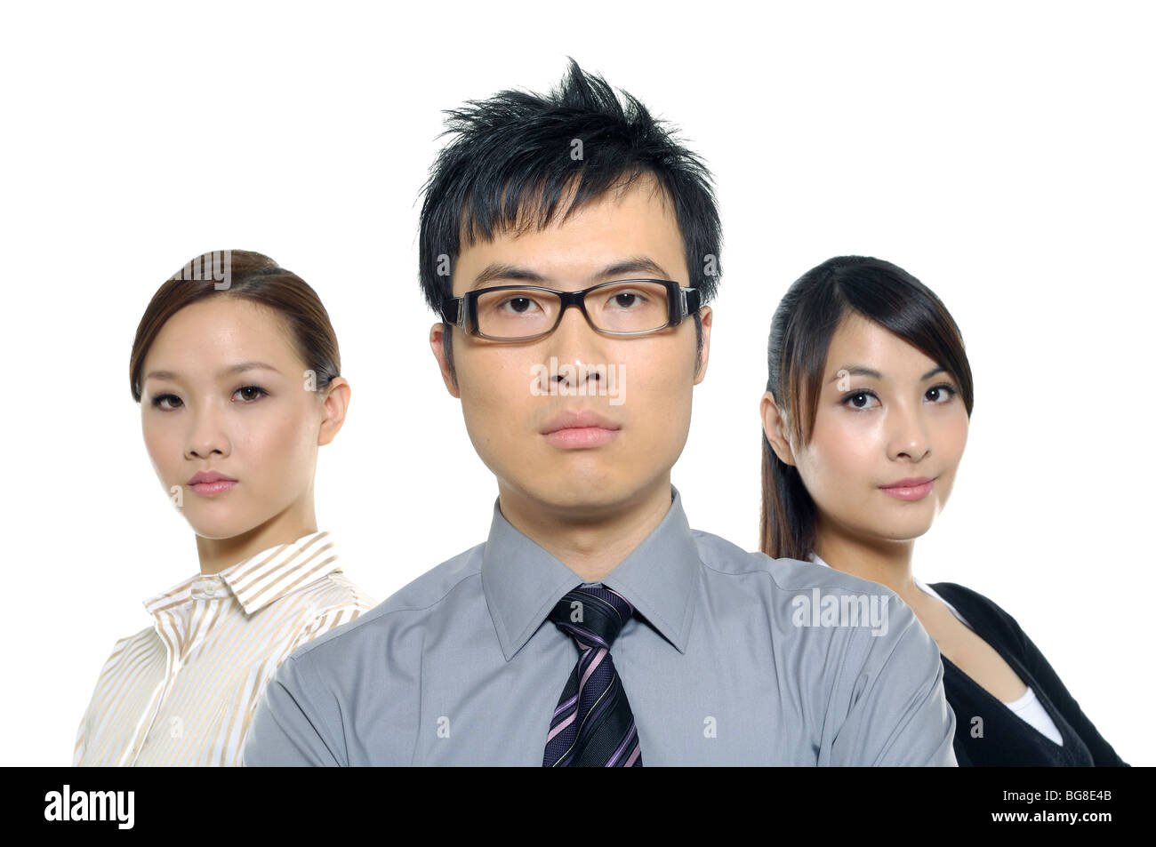 Three businesspeople standing together Stock Photo - Alamy