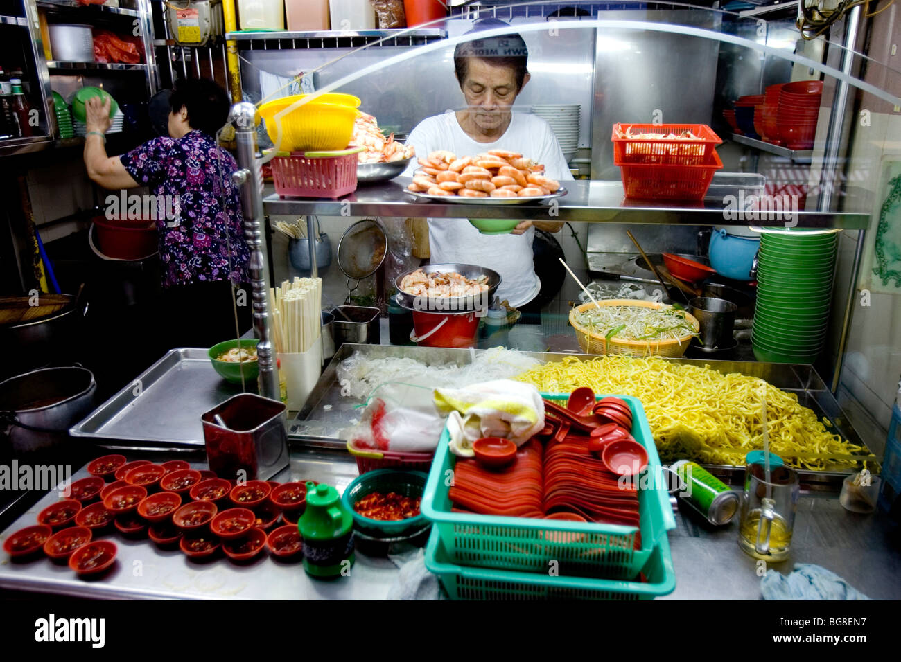 Scene at a noodle stand in Singapore Stock Photo - Alamy