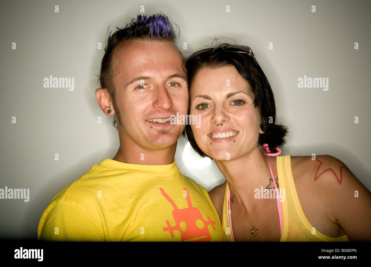 Two people pose at a party Stock Photo - Alamy