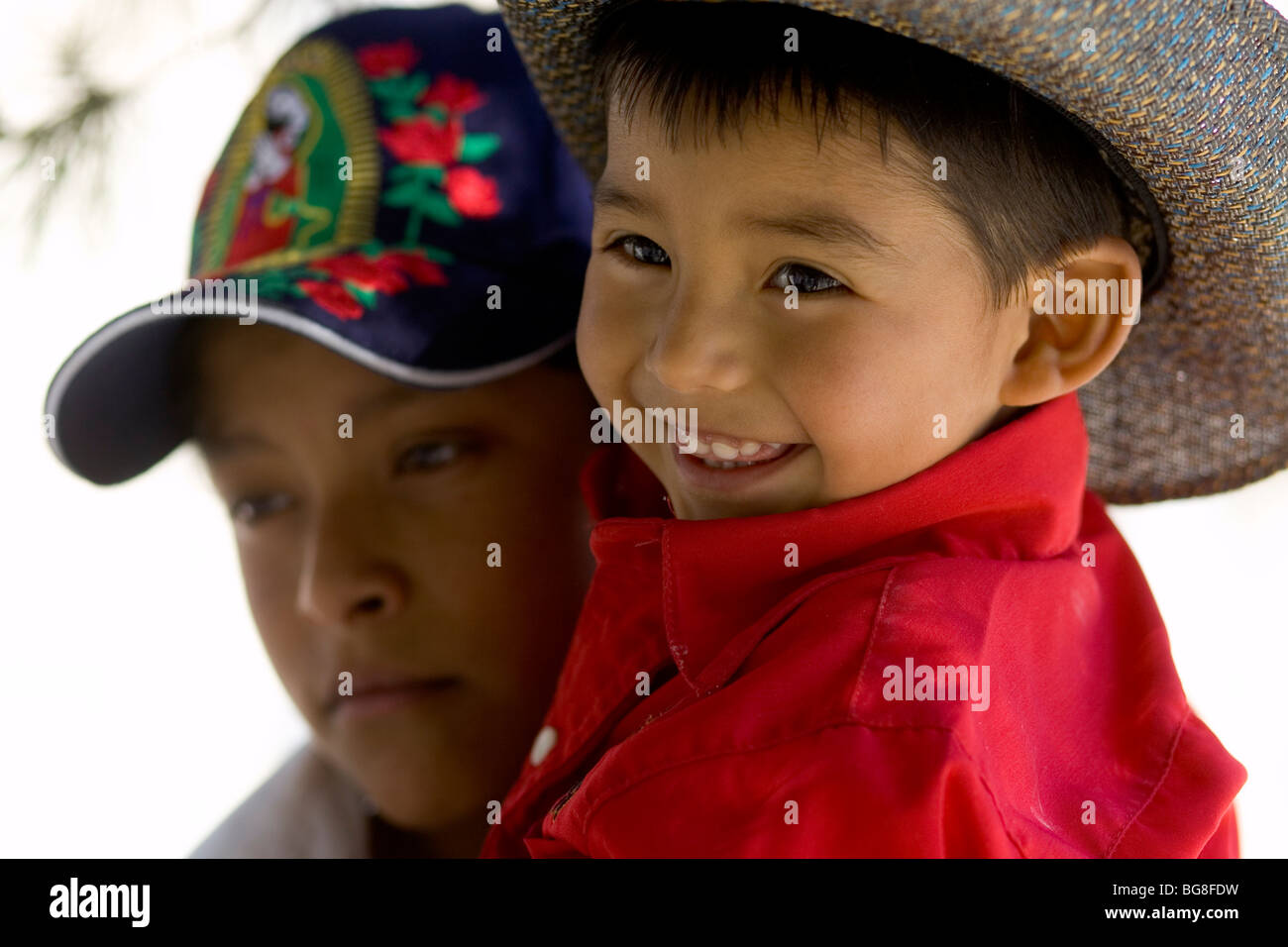 A boy hold his younger brother in his arms in Potrero, Mexico Stock ...