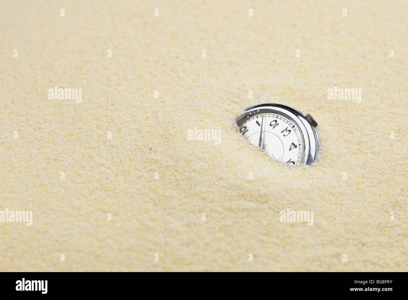 Ancient mechanical watch sinks in sand symbolize leaving time Stock ...