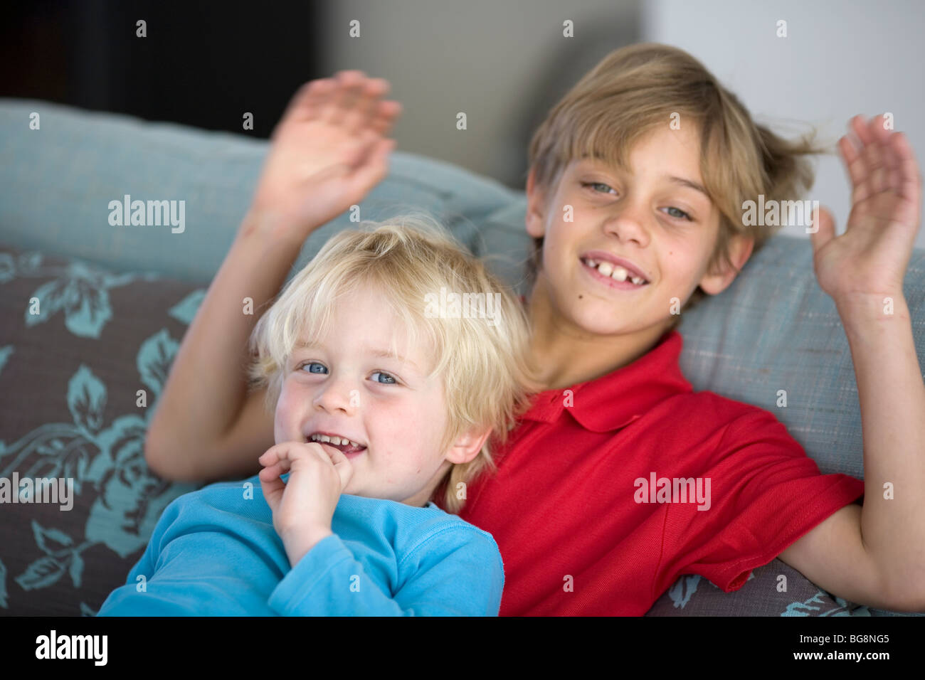 two young brothers together on couch Stock Photo - Alamy