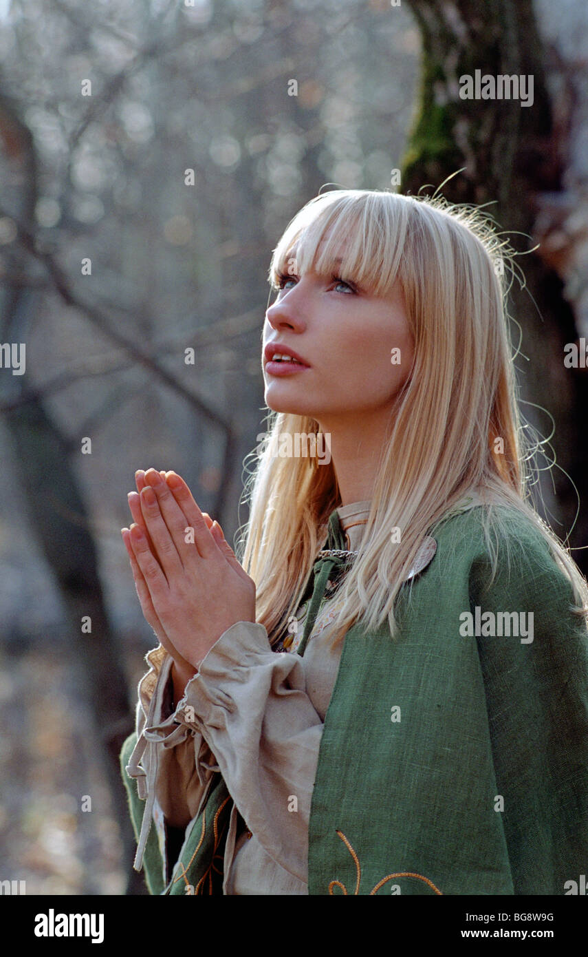 medieval woman praying in forest Stock Photo - Alamy