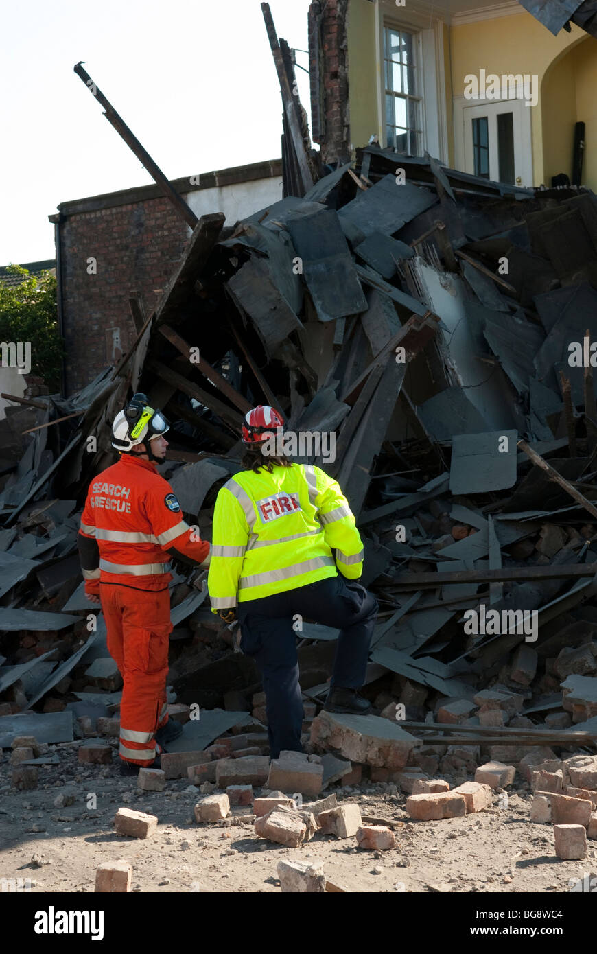 Fire Service USAR Urban Search And Rescue look for trapped people under ...