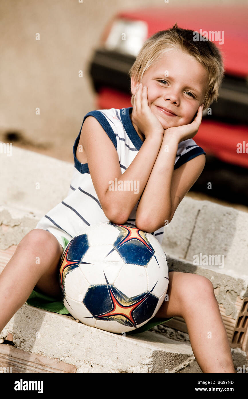 Boy with football Stock Photo - Alamy