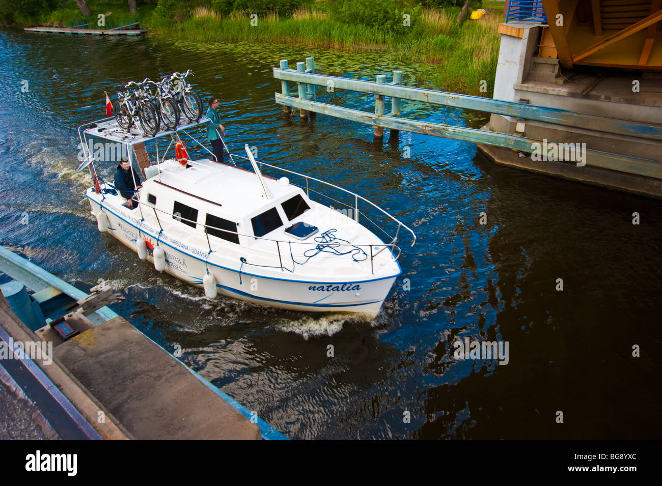 Charter yacht passing the drawbridge over Szkarpawa River / Elbinger ...