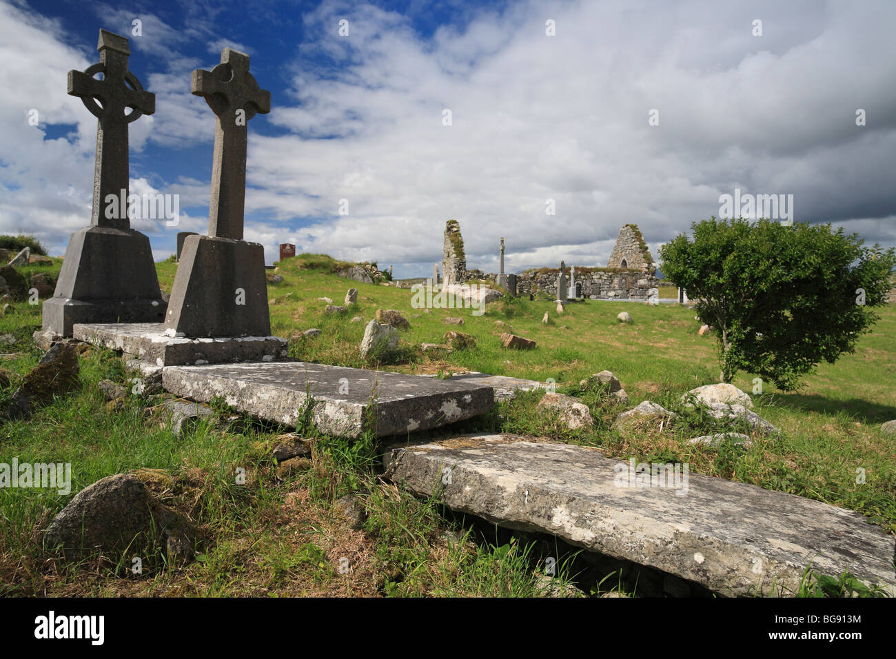 Celtic crosses and a roofless church at the cemetery in Carna ...
